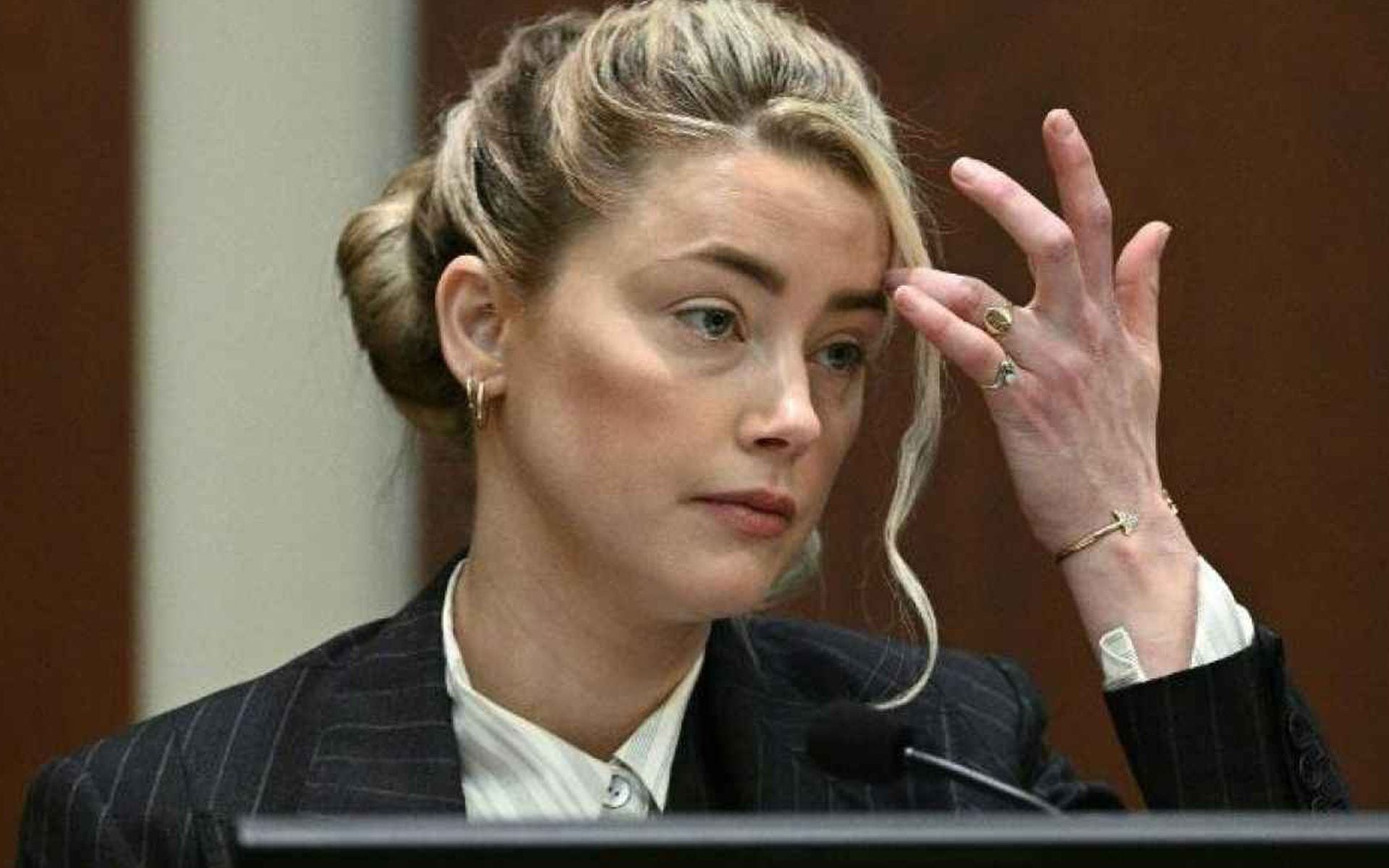 Why was Amber Heard accused of using the same photo for 2 alleged ...