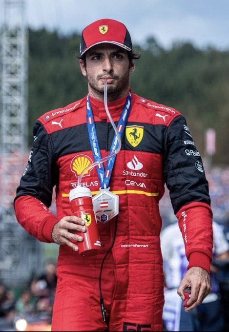 Why do F1 drivers drink from a long straw after a race?